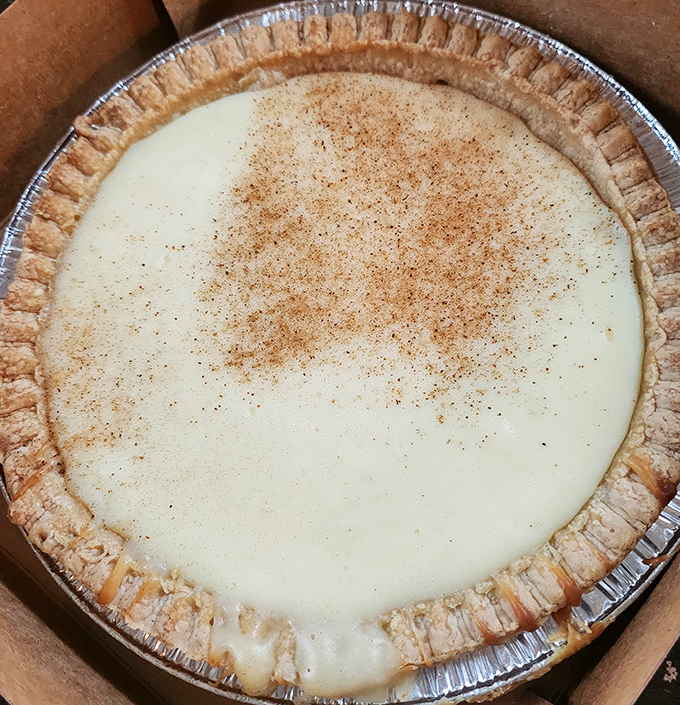 This custard pie with its perfectly crimped edges and dusting of cinnamon isn't just dessert&mdash;it's edible artwork that whispers "resistance is futile."