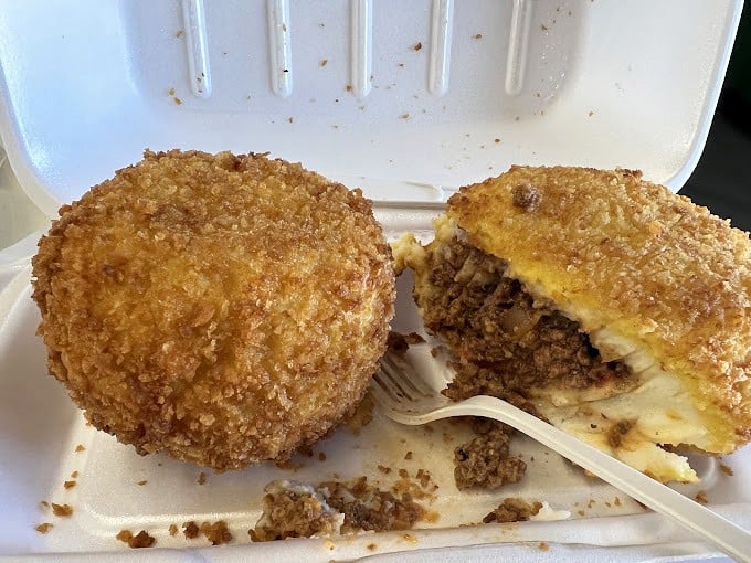 Golden-brown deviled crabs that could make a seafood skeptic weep with joy. These crispy orbs of seasoned blue crab are Tampa's edible treasure.