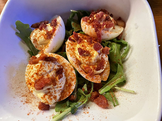 These aren't your grandmother's deviled eggs&mdash;unless your grandmother topped hers with crispy bacon and a sprinkle of spice that makes angels sing.