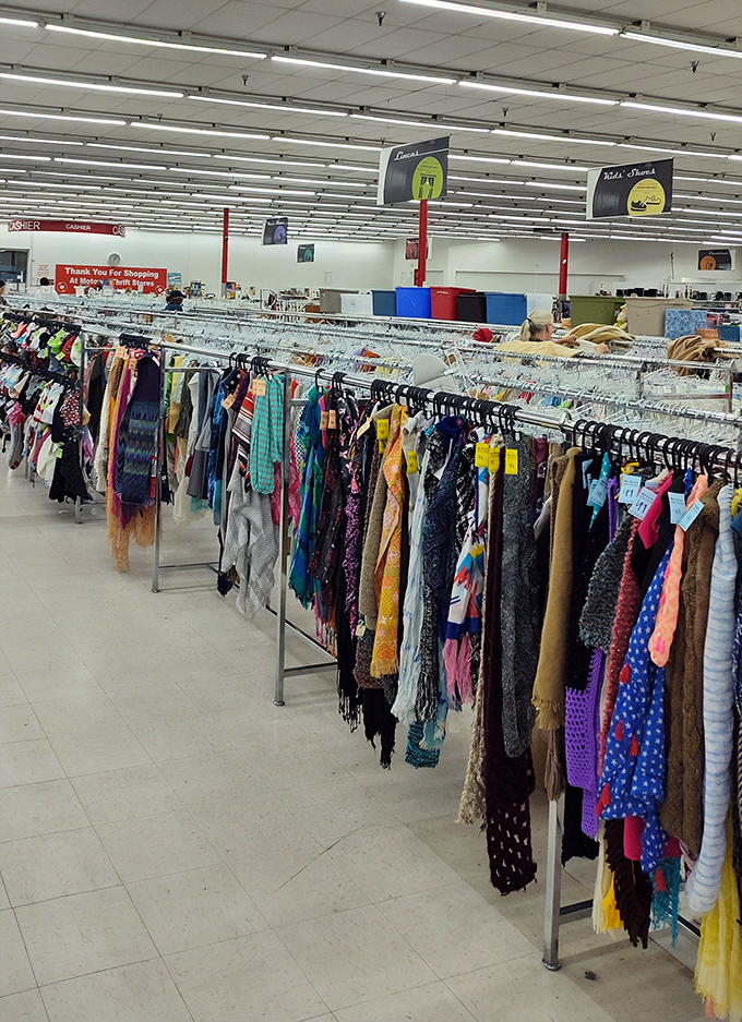 Colorful scarves and garments create a textile rainbow. Each piece whispers stories of previous lives while waiting for its next chapter.