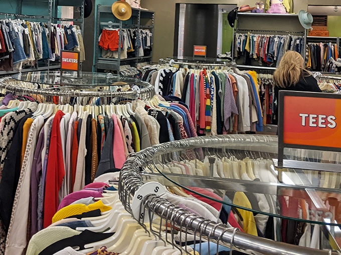 The meticulously organized interior feels more like a boutique than a thrift store, with clothing categorized by type rather than the usual secondhand chaos.
