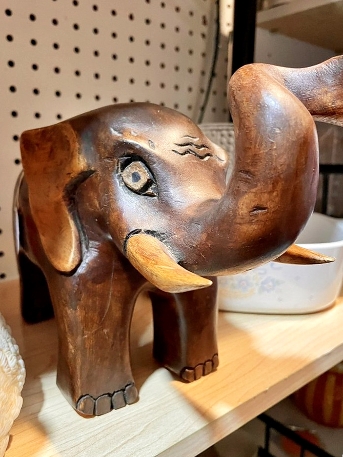 This wooden elephant sculpture isn't just decor&mdash;it's a conversation starter with personality to spare. Those expressive eyes have witnessed decades of history.