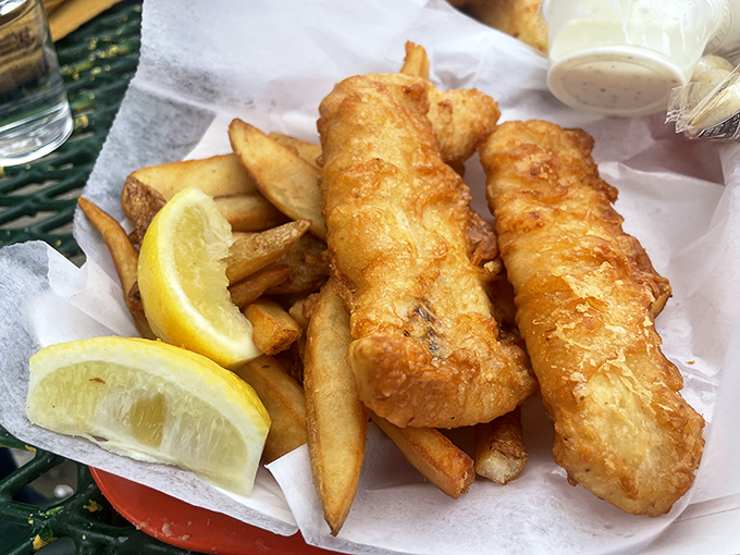 Golden-battered fish that shatters with each bite, paired with hand-cut fries and lemon wedges&mdash;seafood simplicity at its finest.