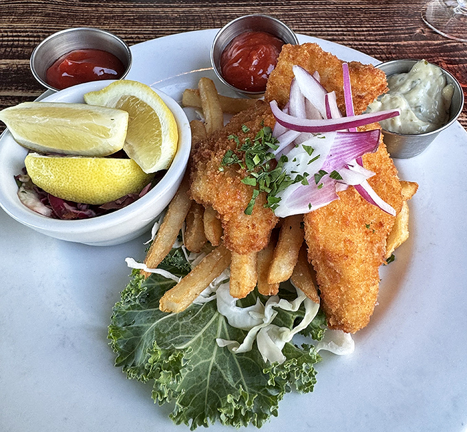 Golden-battered fish that shatters with each bite, served with fries that could make a Frenchman weep. The garnish isn't decoration&mdash;it's a vitamin supplement.