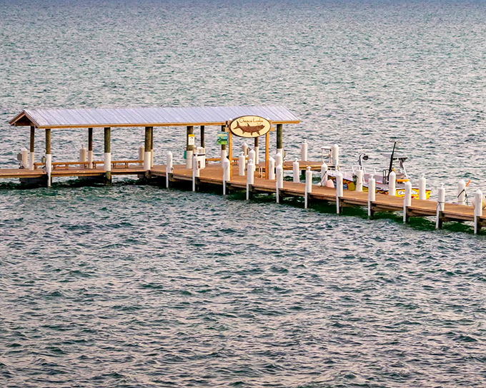 This fishing pier stretches toward the horizon like an invitation, promising adventures that don't require a single email check.