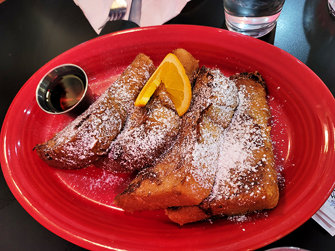 The French toast that launched a thousand return visits. Golden-brown perfection dusted with powdered sugar &ndash; breakfast alchemy at its finest.