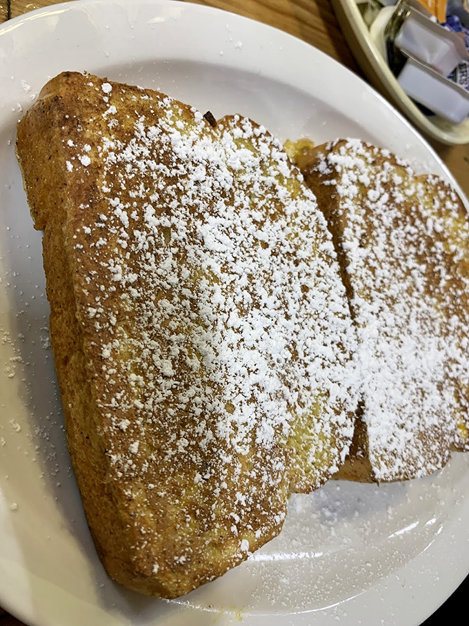 Golden-brown perfection dusted with powdered sugar. This French toast doesn't need fancy toppings or Instagram filters &ndash; it's the breakfast equivalent of finding a unicorn.