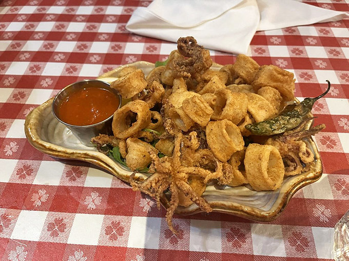 Golden-fried calamari that shatters with each bite, served with peppers that add just enough kick to wake up your senses. Perfection on a shell-shaped plate.