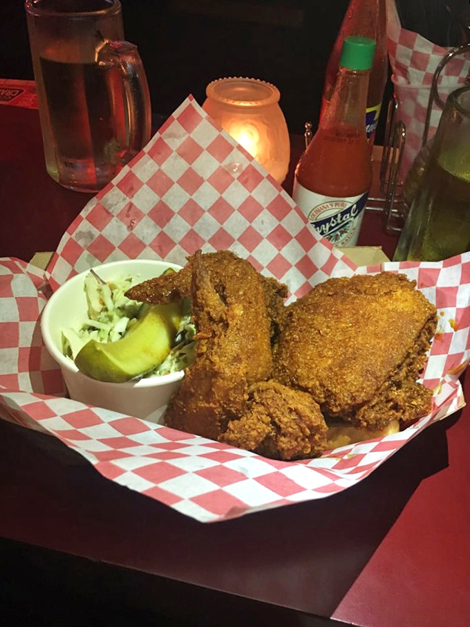 Golden-brown perfection nestled in checkered paper &ndash; this chicken doesn't need fancy plating when it's dressed in a crust that crackles like a vinyl record.