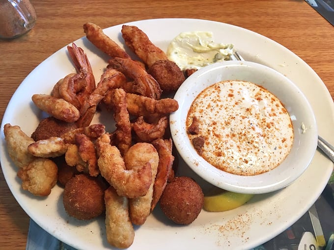 Fried seafood heaven on a plate! These golden-brown treasures and hush puppies are the reason elastic-waist pants were invented.