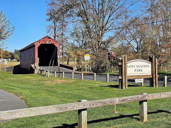 The park's welcome sign stands sentinel beside this historic gem. A reminder that some places are worth preserving for generations.