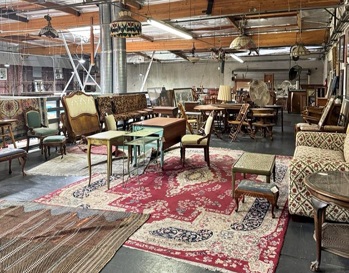Mid-century furniture heaven where every piece tells a story. That leopard-print settee has definitely seen some cocktail parties in its day.