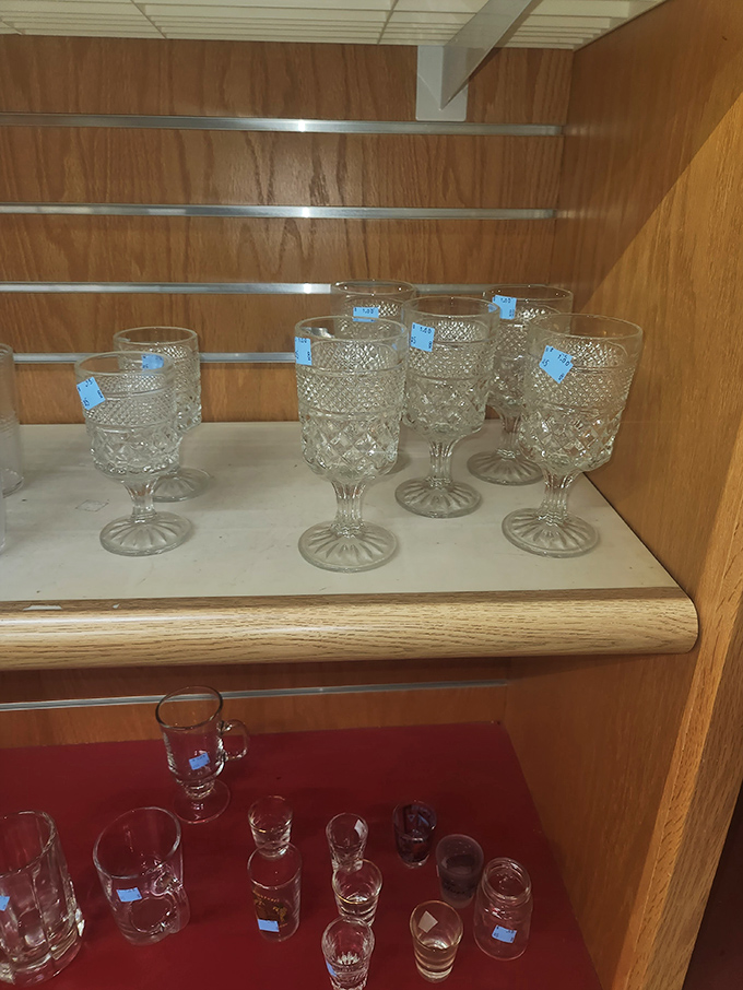 Crystal goblets waiting patiently for their next dinner party, like Downton Abbey extras at a casting call.