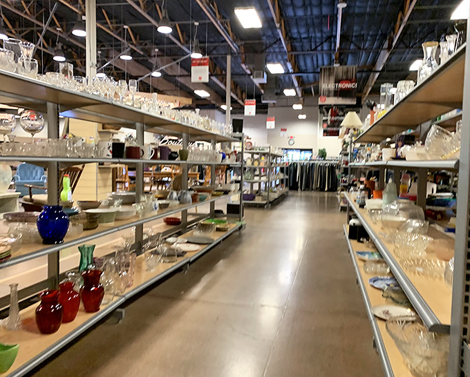 Crystal and glassware gleam under warehouse lighting, waiting to grace someone's next dinner party celebration.
