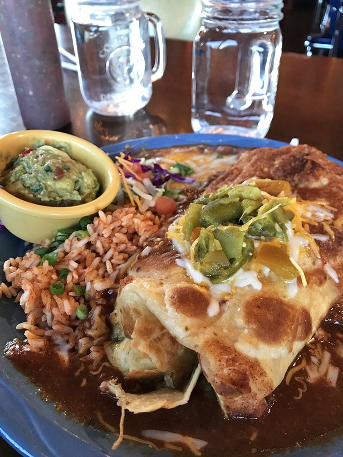 Behold the legendary green chili pork burrito that's converting skeptics into believers one bite at a time. 