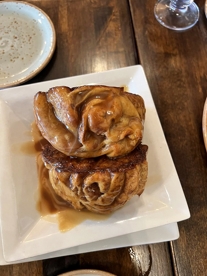 These aren't just cinnamon rolls; they're edible architecture - layers of buttery dough and caramelized cinnamon that make you forget your table manners.