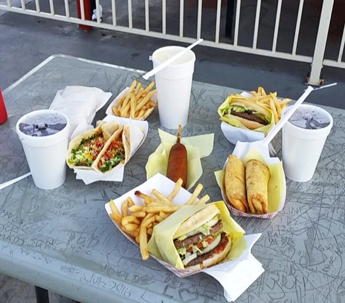 The ultimate tabletop spread—where corn dogs, burgers, and fries create a symphony of comfort that Mozart himself would have appreciated.