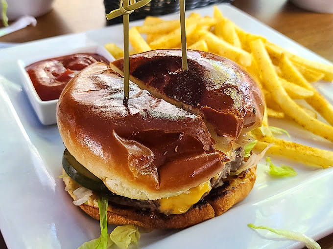 Behold the burger that launched a thousand debates! Golden brioche, melty cheese, and a patty cooked to that perfect sweet spot between heaven and more heaven.