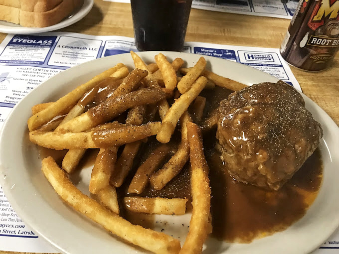 The star of the show: a hamburger steak swimming in gravy that could make even your most stoic uncle weep with joy.