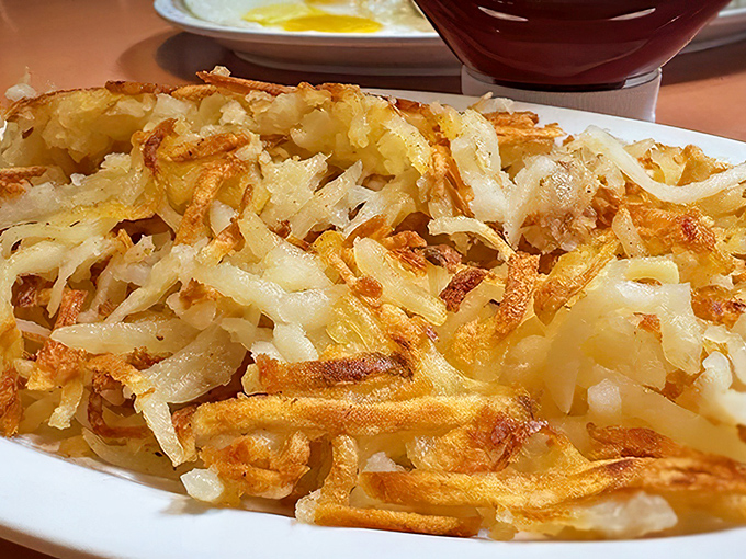 The star of the show: hash browns that achieve the impossible balance of crispy exterior and tender interior. This is potato perfection, folks.