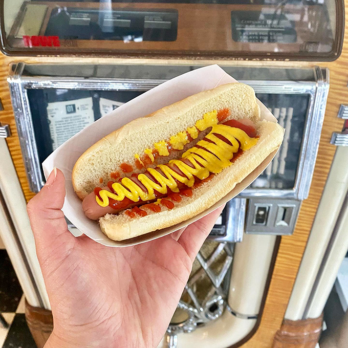 The Coney Dog in its natural habitat—adorned with chili and that perfect zigzag of mustard. Some food doesn't need innovation, just appreciation.
