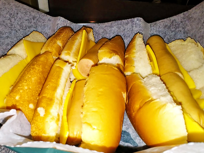 Hot dogs lined up like culinary soldiers, ready to march triumphantly into your heart and stomach with equal enthusiasm.