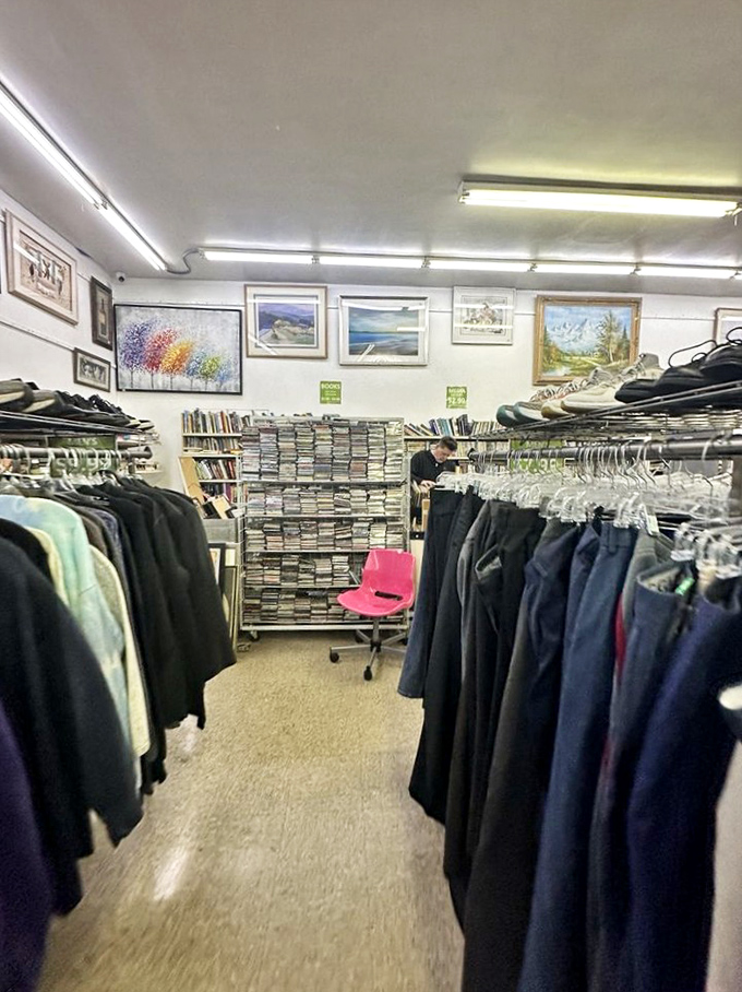 Clothing racks create a textile canyon where vintage hunters navigate with the determination of Lewis and Clark, but with better outfit options.