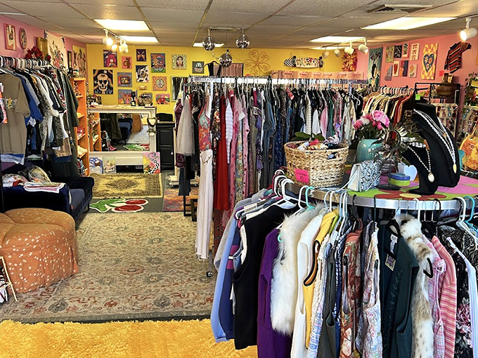 Sunshine yellow walls frame this vintage paradise where clothing racks create pathways to nostalgia. The vintage store equivalent of "choose your own adventure."