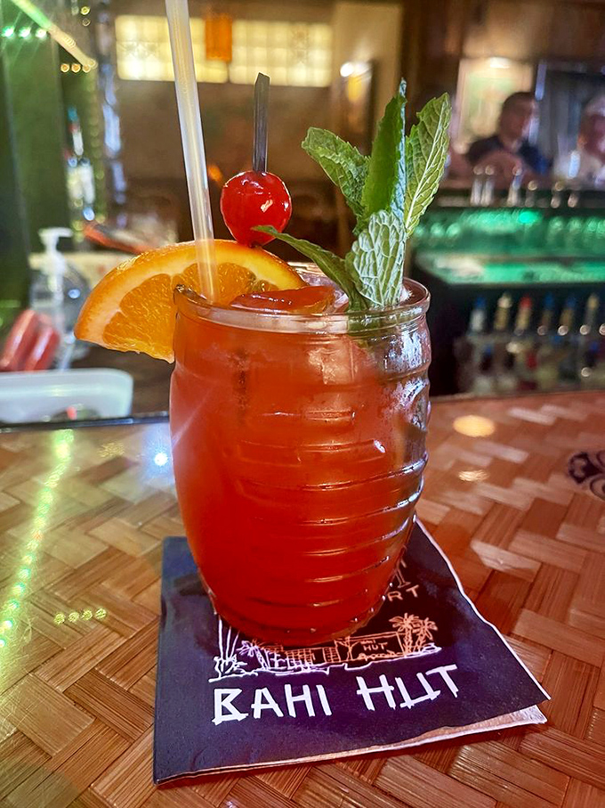 A perfectly crafted Mai Tai arrives with ceremonial garnishes that make every sip feel like vacation.