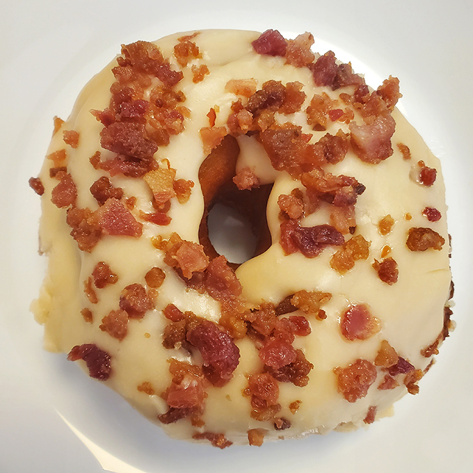 The maple bacon donut—where breakfast meets dessert in perfect harmony. It's what would happen if pancakes and bacon decided to elope and live deliciously ever after.