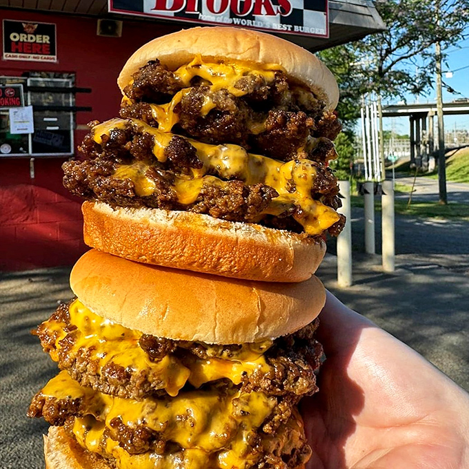 Not so much a burger as a skyscraper of beef and cheese. This towering creation makes Manhattan's skyline look modest by comparison.