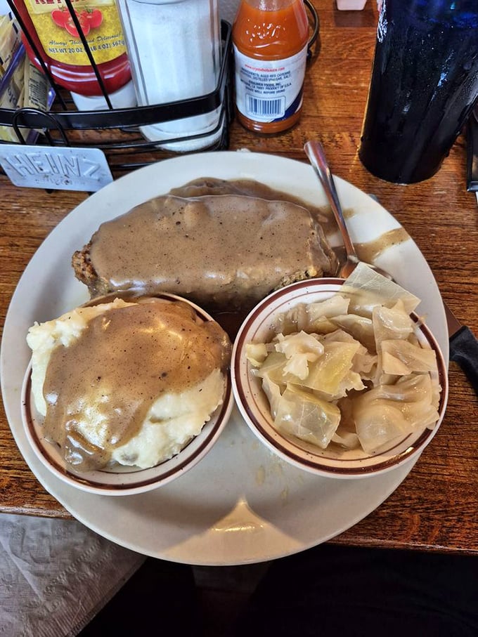 This isn't just meatloaf; it's a masterclass in comfort, smothered in gravy that would make your grandmother both proud and jealous.