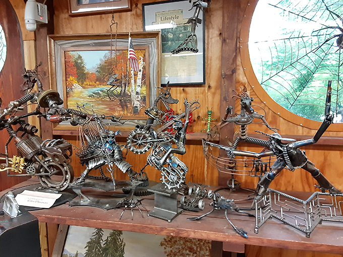 Inside the workshop, miniature metal marvels dance across wooden shelves, showcasing the same creativity as their larger outdoor counterparts.