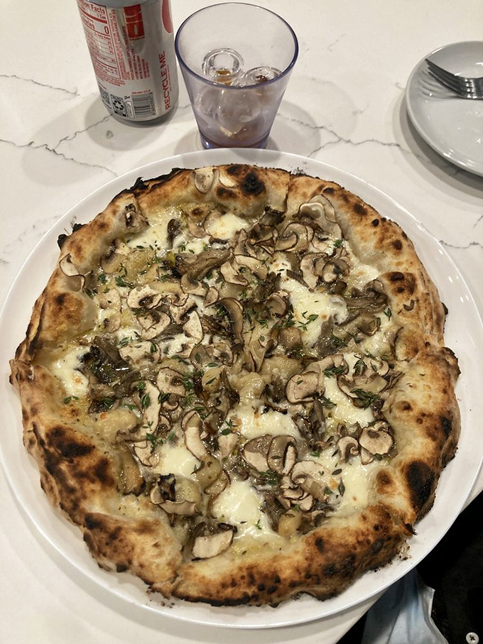 This isn't just mushroom pizza&mdash;it's a fungi festival where each shaved slice has been invited to the party of your lifetime.