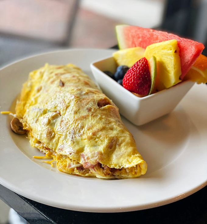 Golden perfection folded around a treasure of fillings. This omelet doesn't just satisfy hunger&mdash;it resolves existential breakfast crises.