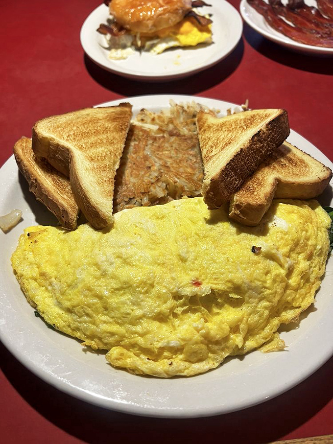 Behold the perfect omelet&mdash;fluffy as a cloud, golden as sunrise, with home fries that could make a potato farmer weep with pride.