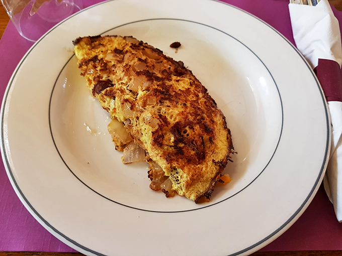 This isn't just an omelet&mdash;it's a masterclass in the art of breakfast engineering, with perfectly browned edges holding a treasure of savory fillings.
