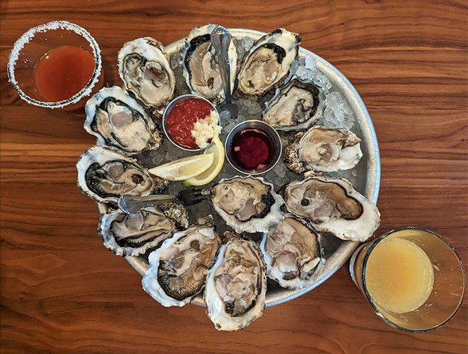 Fresh oysters arranged like a briny clock face, each one a perfect little tide pool of ocean flavor waiting for a squeeze of lemon.