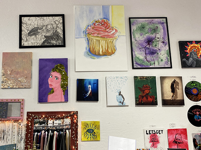 Local art transforms blank walls into a gallery experience, where cupcakes and portraits share space in delightful visual conversation.