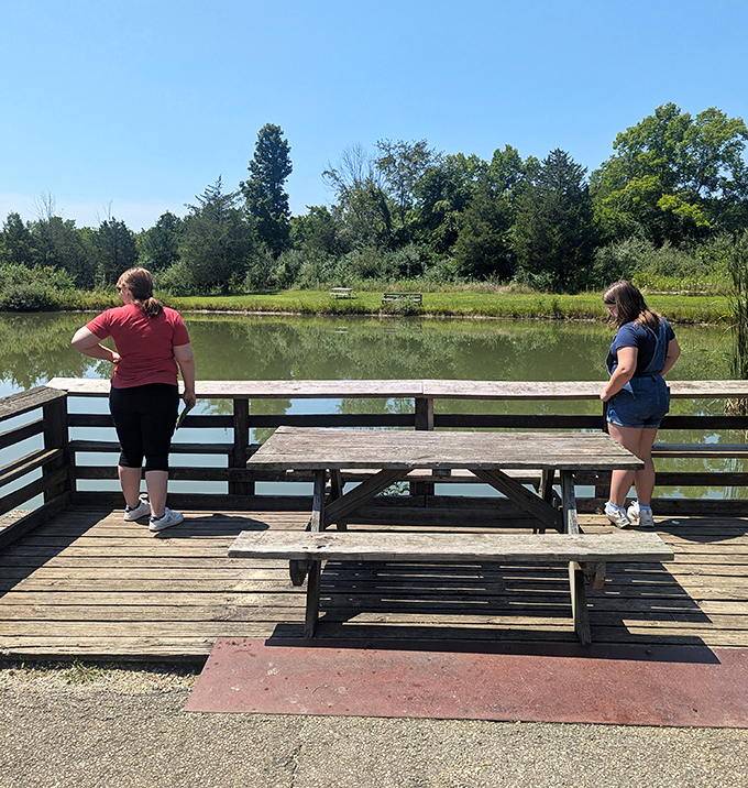 Lakeside contemplation station. Two visitors enjoy the view that no smartphone screen could ever compete with.