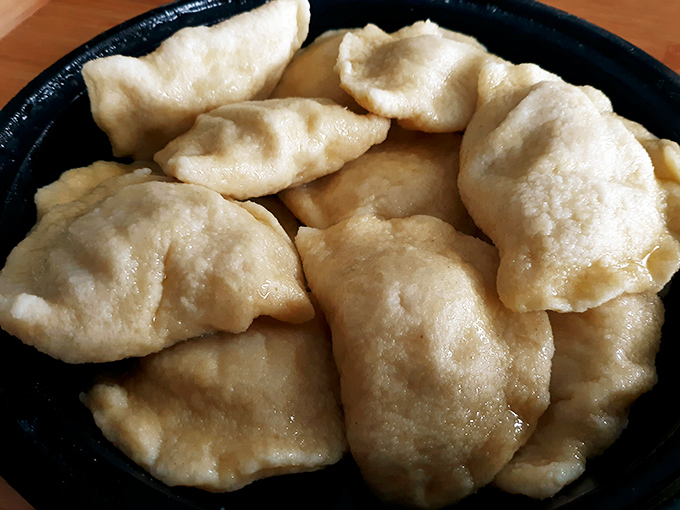 Pillowy pockets of perfection! These golden-brown pierogies aren't just food&mdash;they're edible time machines transporting you straight to a Polish grandmother's kitchen.