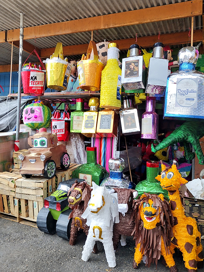 Pi&ntilde;atas hang in festive suspension, each character silently promising a celebration filled with candy, laughter, and the sweet chaos of tradition.