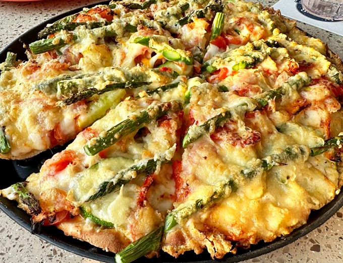 This asparagus-topped masterpiece proves vegetables on pizza aren't just for health nuts. It's what happens when farm-fresh meets comfort food.