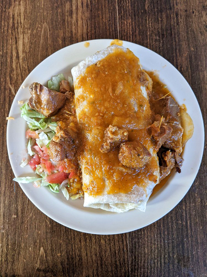 This isn't just a burrito; it's edible architecture. The sauce cascade makes resistance futile&mdash;your shirt will eventually wear some as a badge of honor.