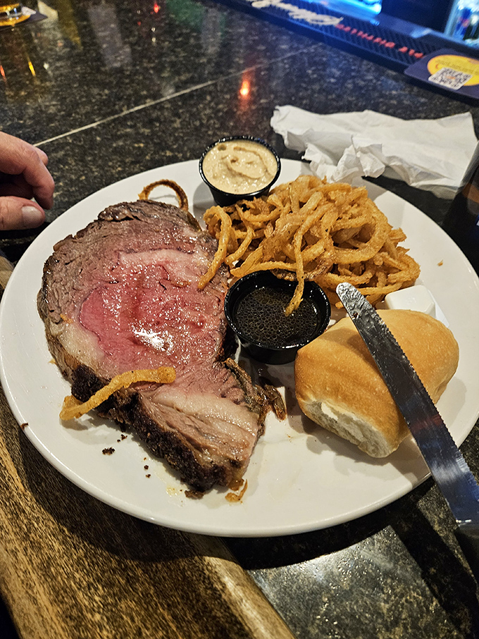 This prime rib isn't just dinner—it's an event. Perfectly pink, impossibly tender, and served with sides that know their supporting role.