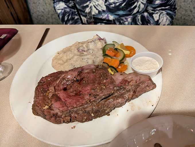 This prime rib isn't just dinner; it's an event. Perfectly pink, seasoned with reverence, and accompanied by sides that know their supporting role.