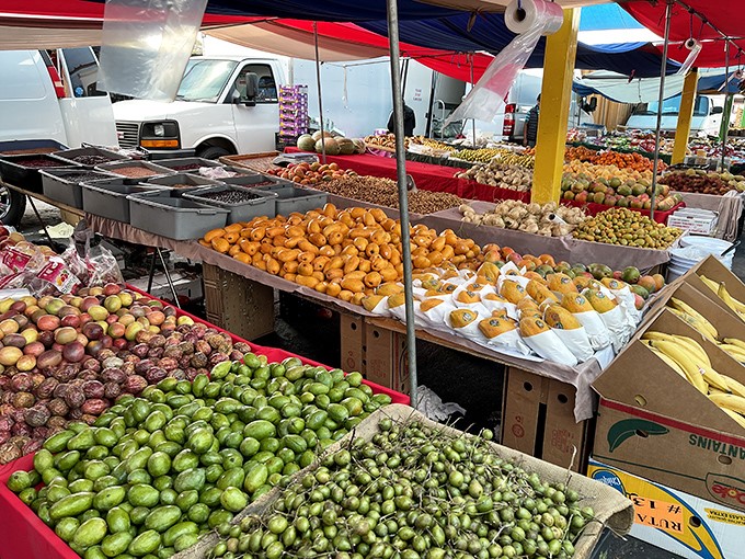 Nature's candy counter where mangoes, avocados, and limes create a vibrant mosaic that makes grocery store produce look like it's been napping.