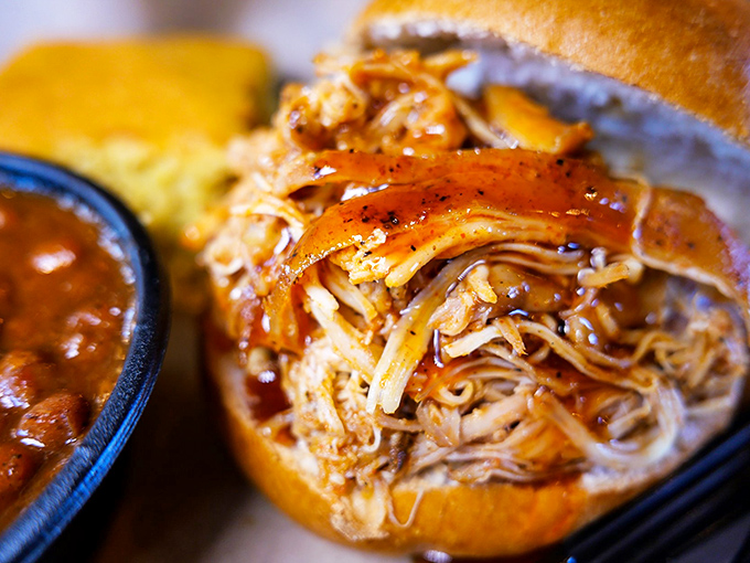 This pulled chicken sandwich isn't just lunch—it's a towering achievement of tender, saucy perfection that demands both hands and several napkins.