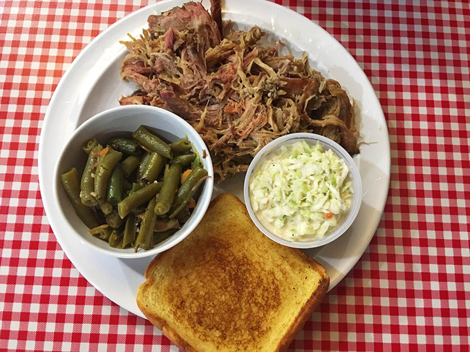 Pulled pork that surrenders completely to the fork. Paired with green beans and slaw, it's the Southern trinity of flavor on a classic checkered tablecloth.