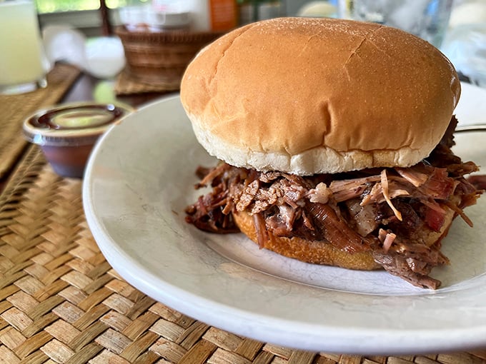 This pulled pork sandwich isn't just a meal&mdash;it's a commitment to excellence that requires both hands and several napkins.